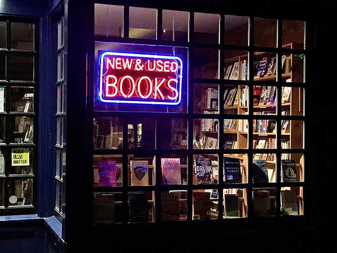 The neon sign glows like a beacon in the night, luring book lovers like moths to a flame. Resistance is futile, embrace the literary love!