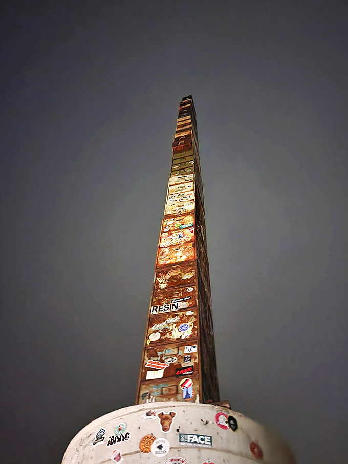 By night, the World's Tallest Filing Cabinet takes on an ethereal glow. It's the nocturnal beacon for lost staplers everywhere.