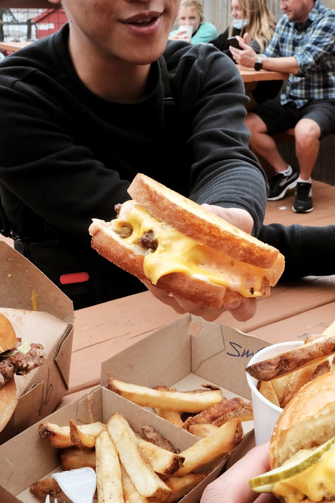 Gooey goodness alert! This patty melt isn't just melting, it's performing a cheesy ballet right before your eyes. Bravo!