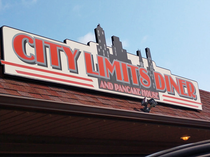 City Limits by day, flavor paradise always. This sign is your bat signal for when hunger strikes and only diner food will do.