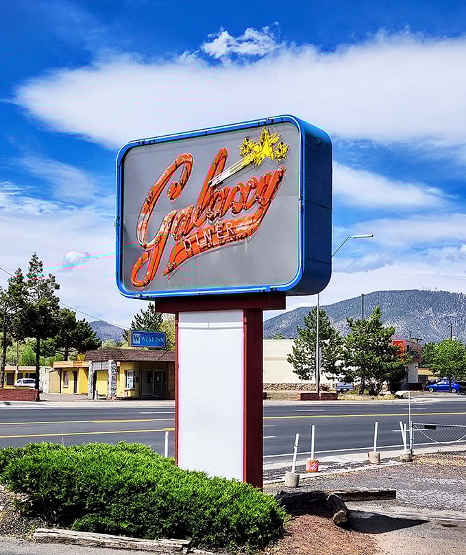 Standing tall and proud, this sign is like a lighthouse for hungry souls. Follow its glow to your new favorite comfort food haven!