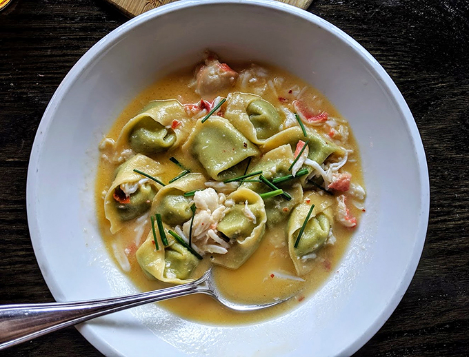 These aren't just tortellini, they're little pasta purses filled with joy. Swimming in a golden pool of deliciousness, they're begging to be rescued by your fork.
