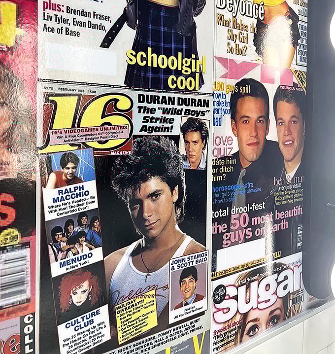 Even the restroom walls tell a story, plastered with 80s and 90s magazine covers that serve as a time capsule.
