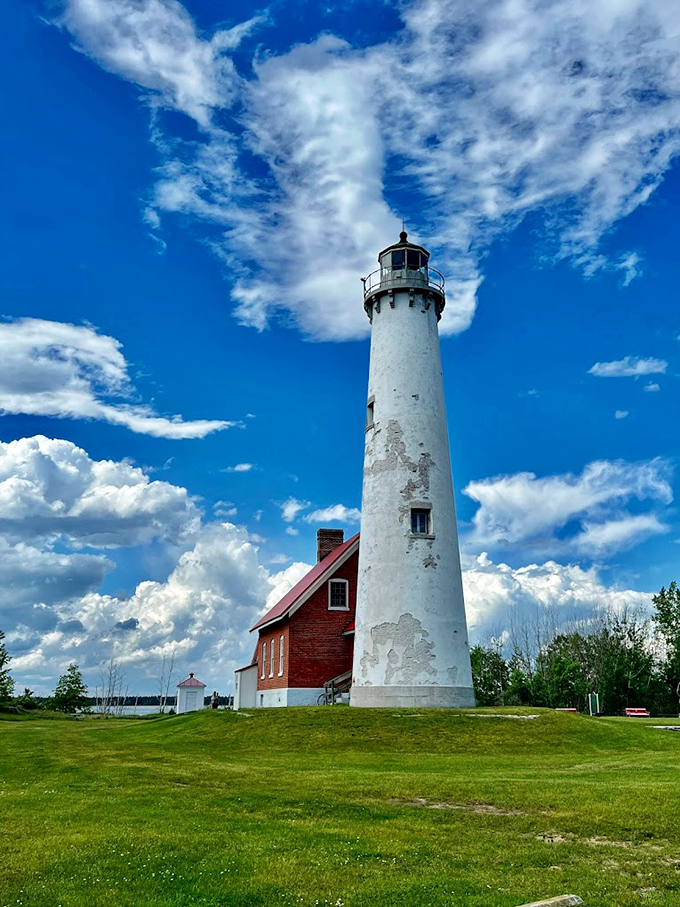 Tawas Point's white sentinel: Where Victorian elegance meets maritime duty. This lighthouse could teach a masterclass in coastal chic. 
