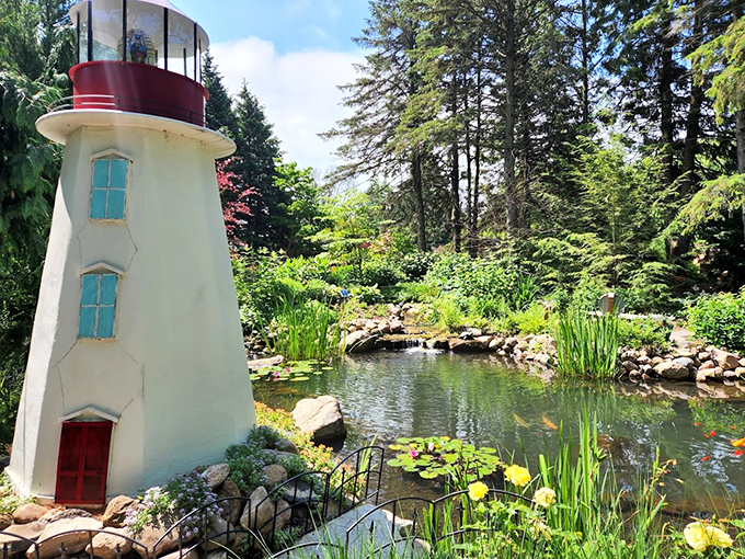 A storybook come to life! This whimsical lighthouse seems ready to guide literary adventures through a sea of colorful blooms.
