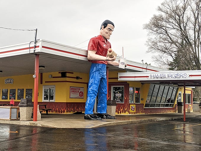 Holy hamburgers, Batman! Gus's giant mascot stands guard, ready to defend your right to delicious drive-in dining. No cape required!