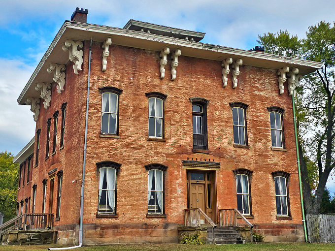 Nature's taking over! This stone fortress looks like it's auditioning for a starring role in "The Secret Garden: Spooky Edition."