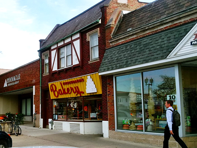 A yellow sign that screams "Bakery!" louder than your grandma at bingo night. Kirschbaum's: where calories fear to tread.