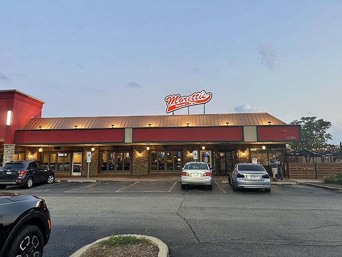 Welcome to pizza paradise! Moretti's red sign beckons like a lighthouse guiding hungry sailors to cheesy shores.