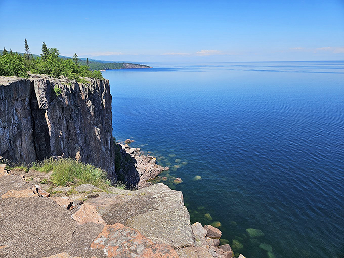 Nature's IMAX! Towering cliffs meet endless blue, creating a view that'll make your heart skip a beat and your camera work overtime. Photo credit: A.J. Patel