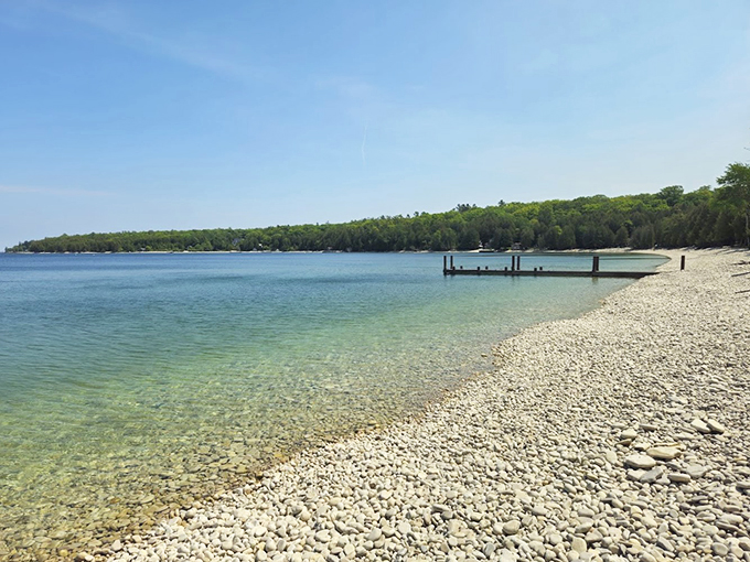 Crystal-clear waters and smooth stones: Nature's own zen garden meets refreshing swim spot.
