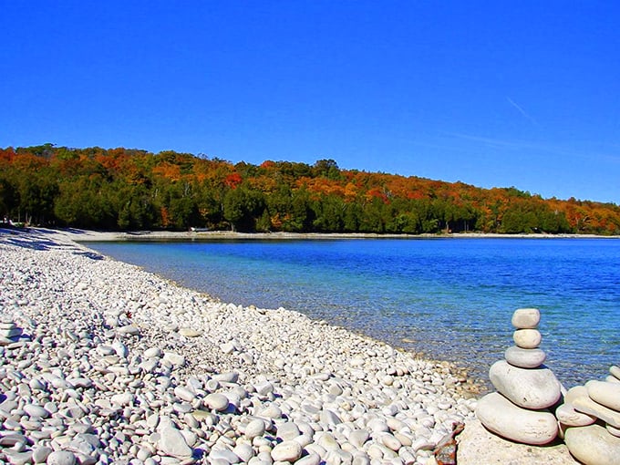 Nature's zen garden! Smooth limestone pebbles massage your feet as crystal-clear Lake Michigan waters whisper secrets of the Great Lakes.