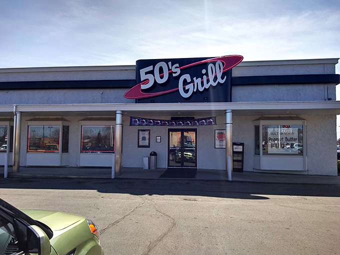 Step into a Norman Rockwell painting come to life. 50's Grill's neon sign beckons you to a world where