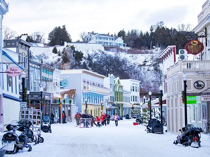 Snow-dusted Victorian buildings rise above Main Street, creating a postcard-perfect scene that time forgot.