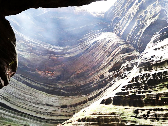 Like walking through Earth's ribcage, this narrow canyon's layered walls tell stories millions of years in the making.