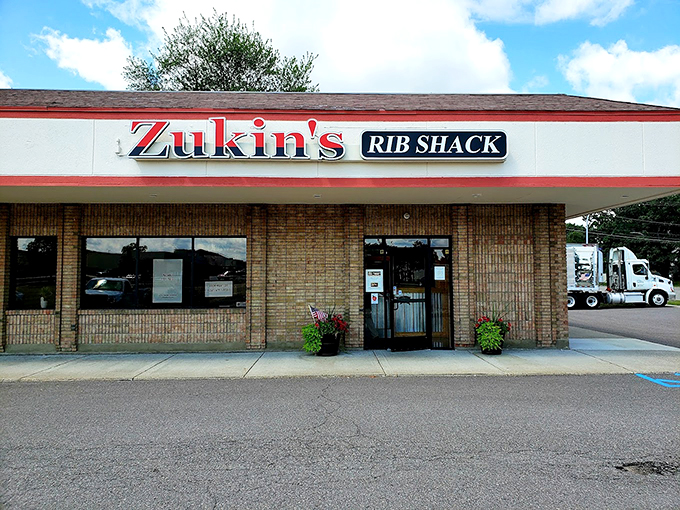 Zukin's: Where simplicity meets flavor! This unassuming brick facade hides a world of smoky delights waiting to be discovered.