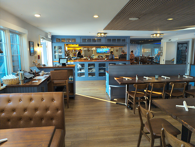 Step inside and feel the warmth wash over you. This isn't just a dining room; it's a cozy maritime hug with a side of mouthwatering aromas.