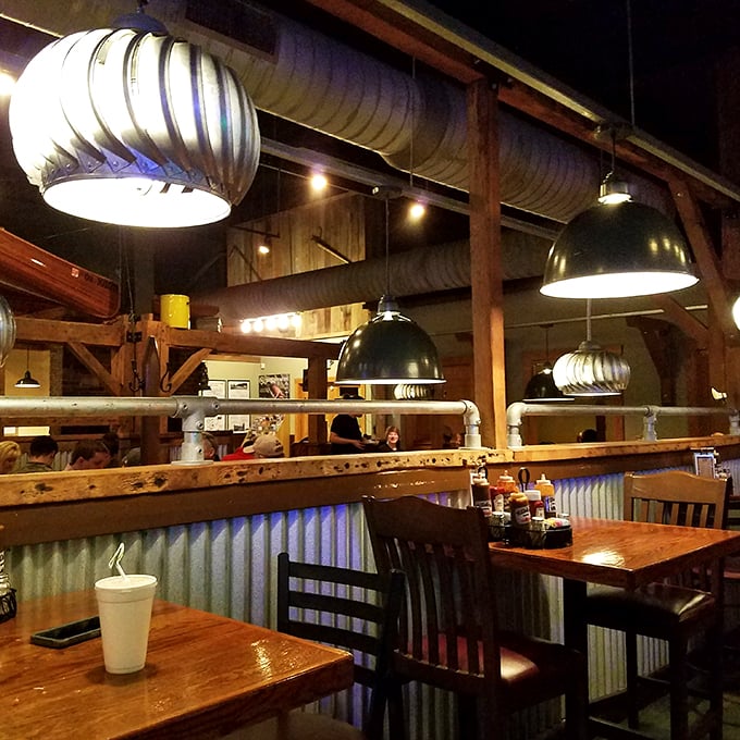 Step inside and feast your eyes! This dining area is like a cozy barn crossed with a chic industrial loft. Comfort meets style, y'all.