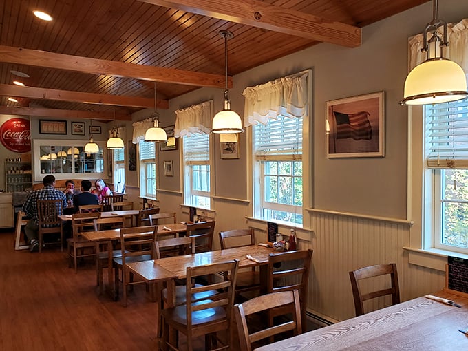 Step into a time capsule of cozy Americana. Wooden beams, warm lighting, and the promise of comfort food &ndash; it's like grandma's house, but with better pancakes.