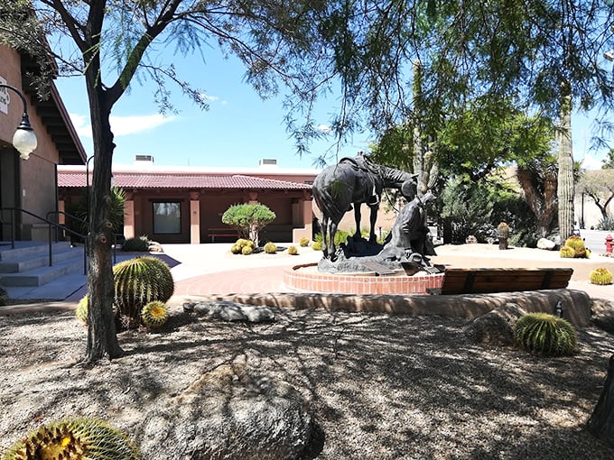 Giddy up to the entrance, where cacti stand guard and a bronze cowpoke tips his hat in eternal greeting.