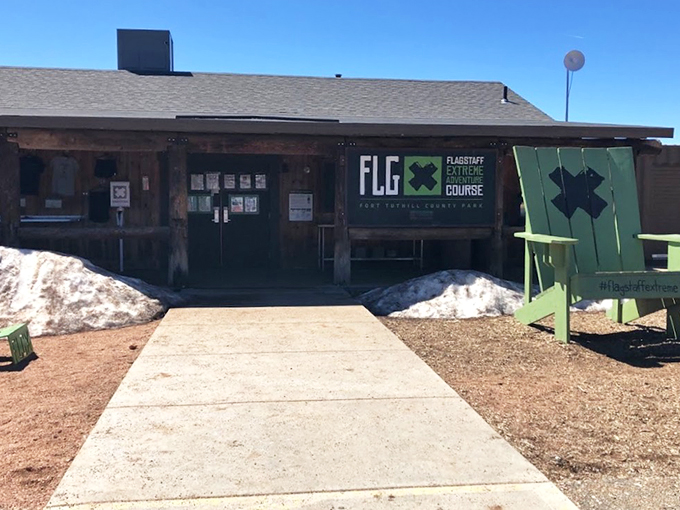 Welcome to Flagstaff Extreme, where "extreme" means "extremely awesome." This rustic entrance is your portal to pine-scented adventure.