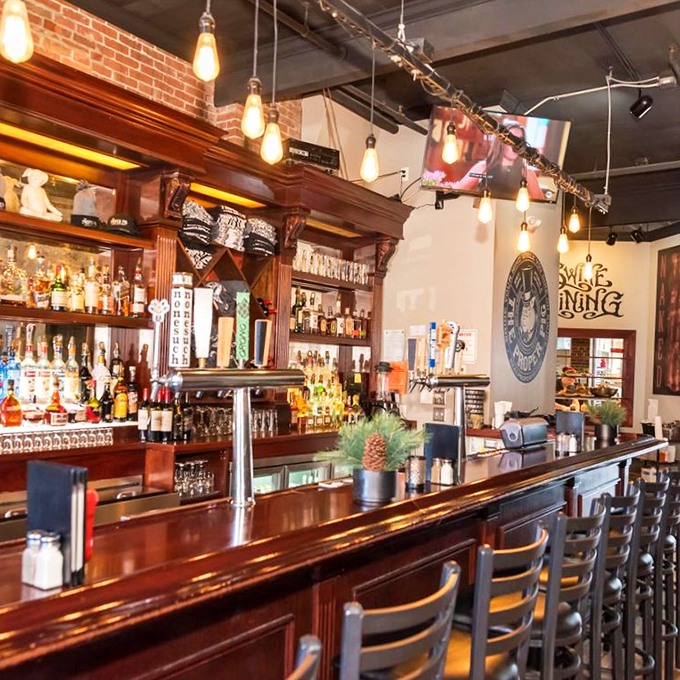 The gleaming wood bar beckons with Edison bulbs overhead and an impressive array of spirits. It's like Cheers, but with better lighting.