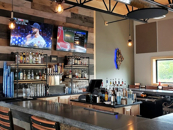 The modern tap room blends rustic charm with sports bar cool - exposed wood, Edison bulbs, and enough screens to catch every Sox game.