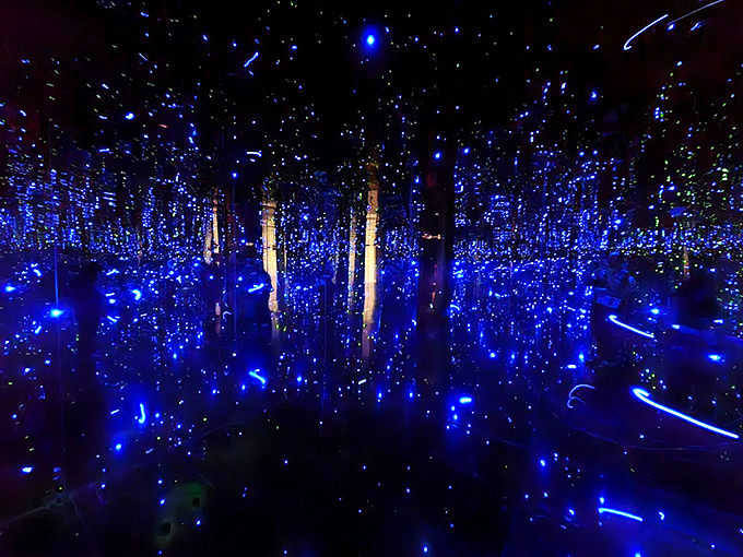 Electric blue LEDs transform the space into an underwater dreamscape where stars have decided to go swimming.