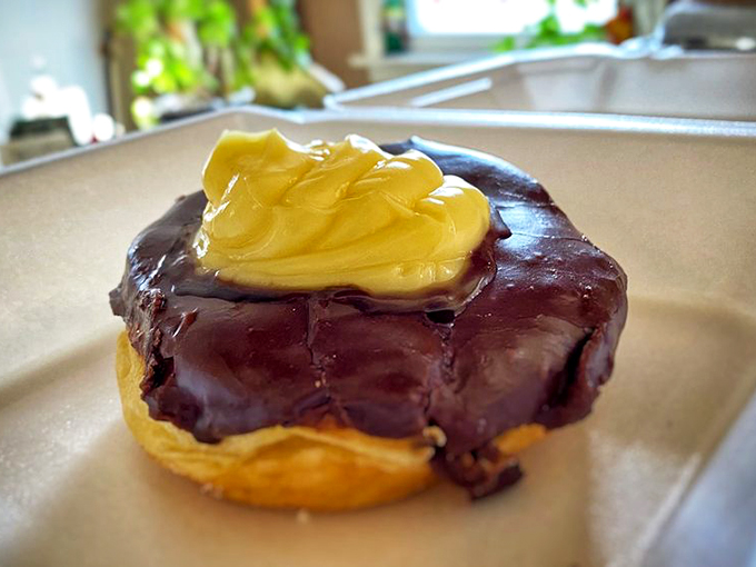 This chocolate-dipped beauty with its golden custard crown proves that sometimes the best things in life come with filling.