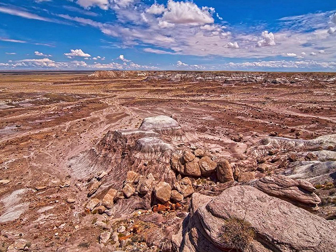 Mother Nature's abstract masterpiece unfolds before your eyes. It's like someone spilled a cosmic paint set across the Arizona desert.