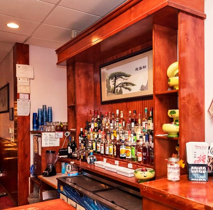 Behind this well-stocked bar, traditional meets tropical in a display that would make any mixologist smile with delight.