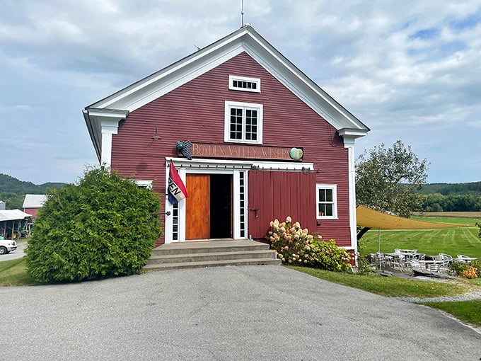 Step into a postcard-perfect scene! This classic red barn entrance isn't just eye candy&mdash;it's your gateway to a world of Vermont-crafted wines and unforgettable tastings.