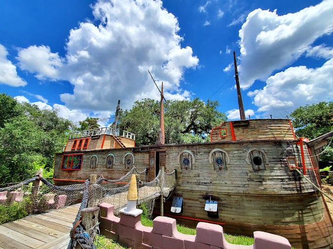 The "Boat in the Moat" restaurant brings whimsical nautical charm to landlocked Ona, complete with mock masts and playful porthole windows.