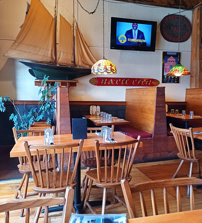 Tiffany lamps cast a warm glow over wooden tables while model ships keep watch &ndash; it's like dining in a cozy captain's quarters.