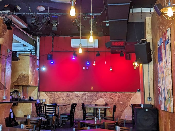 Red walls, Edison bulbs, and exposed brick create an atmosphere that's equal parts cozy bistro and hip music venue.