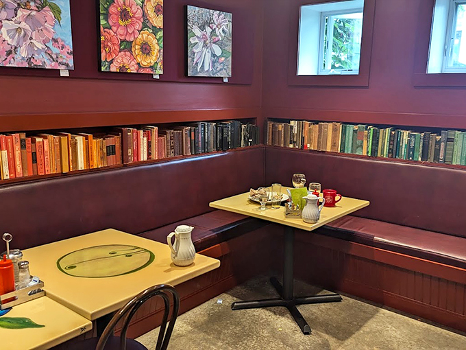 Books line the purple walls while yellow tables add a pop of whimsy. It's like your favorite library and breakfast spot had a delicious baby. Photo credit: Em