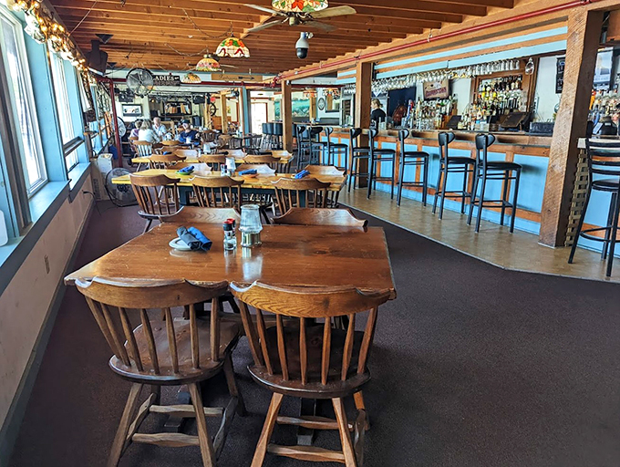 Tiffany lamps cast a warm glow over rustic wooden tables, creating the kind of cozy atmosphere that makes you want to linger.