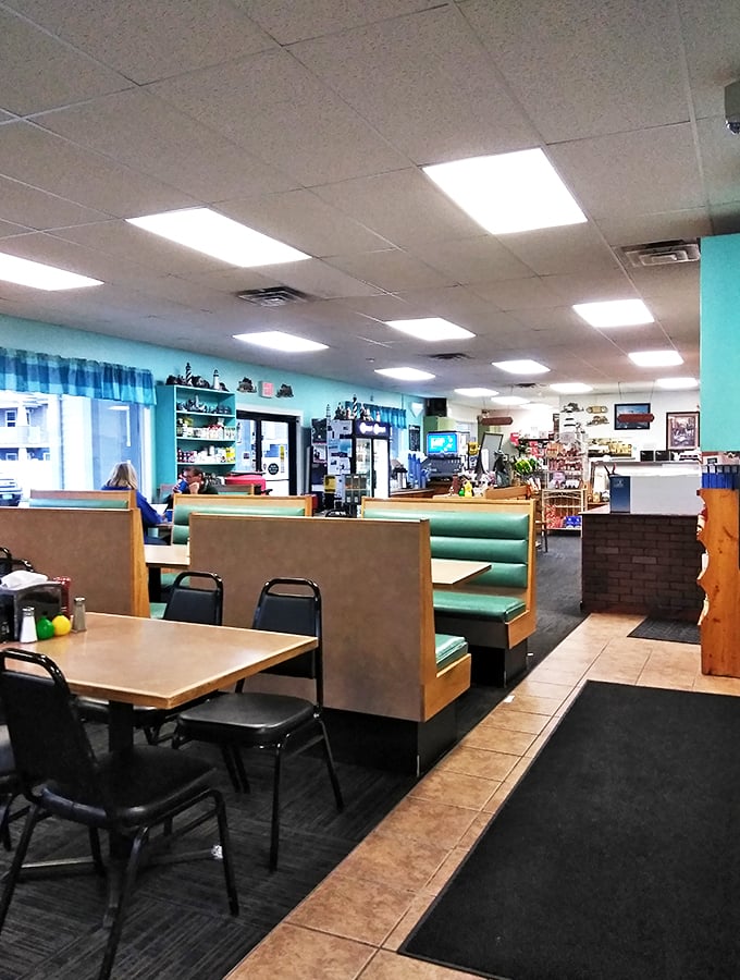 Aqua walls and cozy booths create the perfect backdrop for seafood stories, like a casual maritime diner transported straight from the coast.