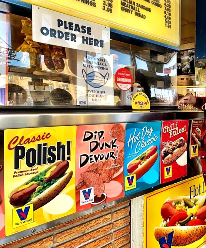 Classic Vienna Beef signs and a well-worn menu board tell stories of countless Chicago-style feasts served here.