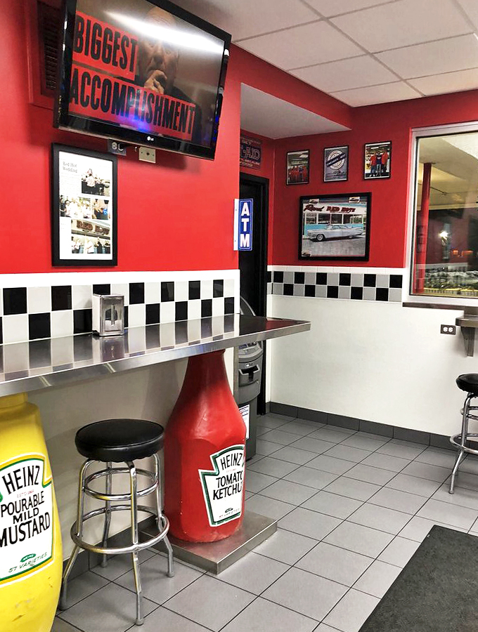 The checkerboard tiles and retro decor aren't trying to be vintage&mdash;they've earned their authenticity one hot dog at a time.