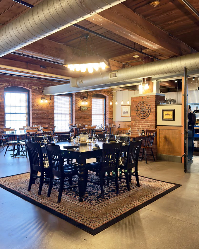 Exposed brick walls and soaring windows create an atmosphere that perfectly balances industrial chic with New England charm. 