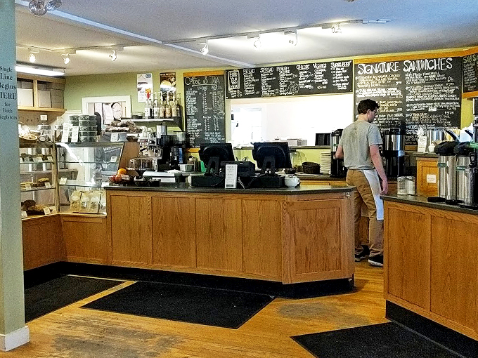 Wooden counters and chalkboard menus create the perfect stage for daily bread theater, where pastry dreams come true.