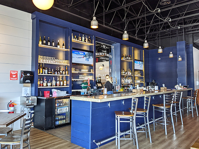 Navy blue walls and gleaming bottles create an atmosphere that's more upscale bistro than casual seafood joint.