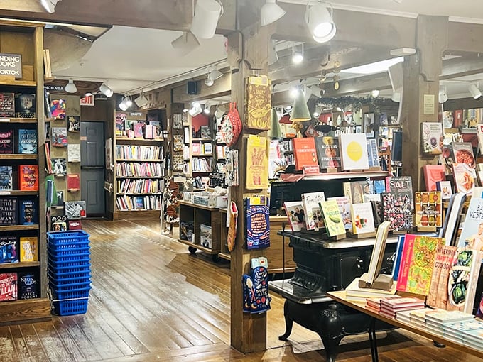 Wooden beams and warm lighting create the perfect backdrop for literary treasure hunting, with books stacked like stories waiting to unfold.