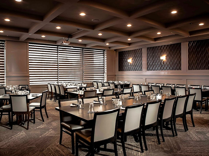 Modern elegance meets cozy comfort in this dining room, where coffered ceilings and geometric patterns create an atmosphere worth lingering in.