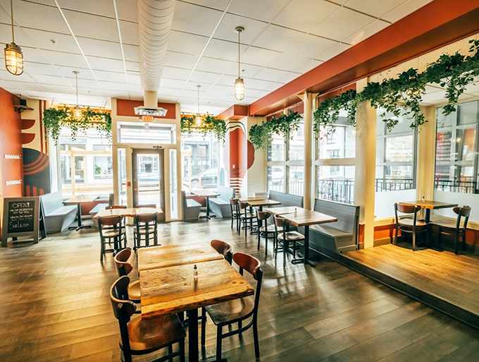Modern meets maritime in this stylish dining room, where exposed brick and warm wood create the perfect backdrop for seafood stories.