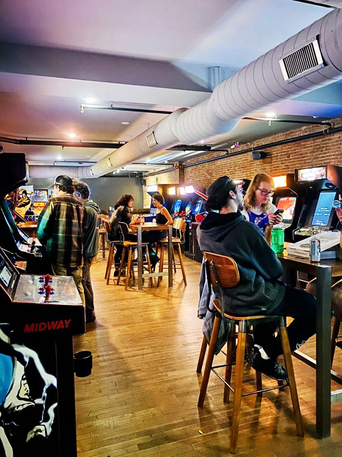 Pixels and pints collide in this gamer's paradise. The gentle hum of arcade cabinets mingles with clinking glasses, creating a symphony of nostalgia.