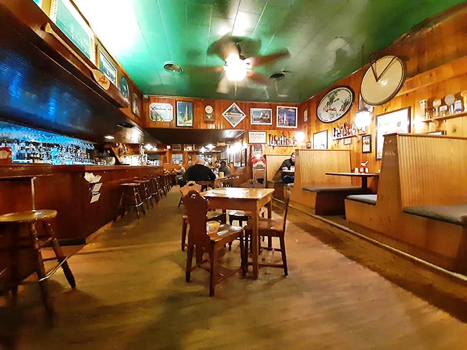 Wood-paneled walls tell stories while the green ceiling adds that perfect touch of small-town charm.