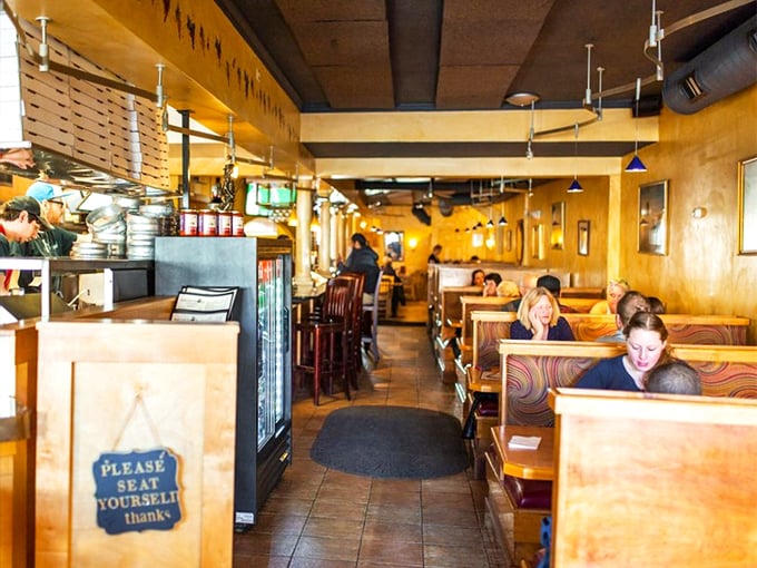 Step into Mimmo's, where the aroma of melting cheese meets the buzz of happy diners. It's like walking onto the set of "Cheers," but with better food.