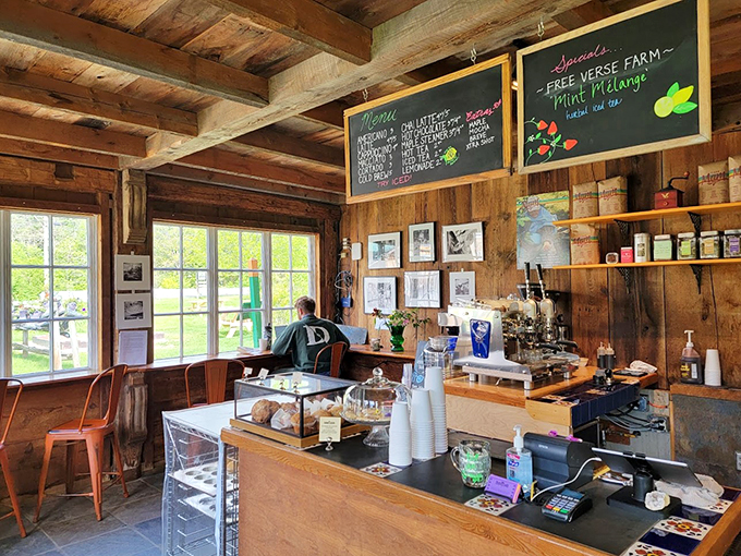 Rustic wooden beams frame a cozy coffee haven where local artwork and the aroma of fresh-baked goodness tell stories.